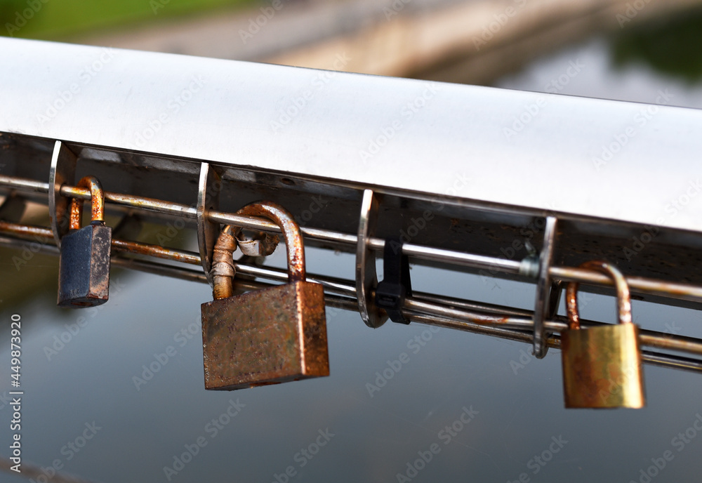 Padlock on Lovers Lock Bridge. Husband and wife during the wedding hung ...