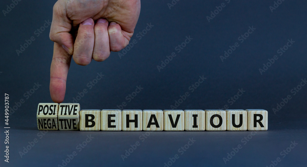 Positive or negative behaviour symbol. Businessman turns cubes, changes ...