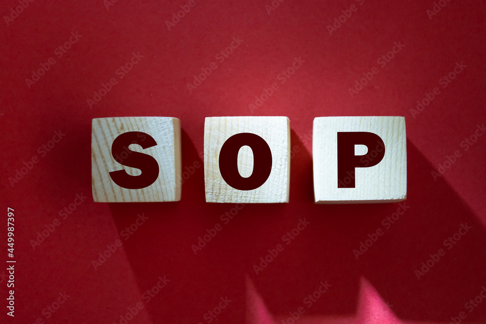SOP - acronym from wooden blocks with letters, abbreviation SOP ...