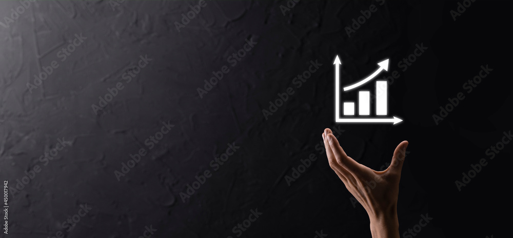 Businessman man holding a graph with positive profits growth. plan ...