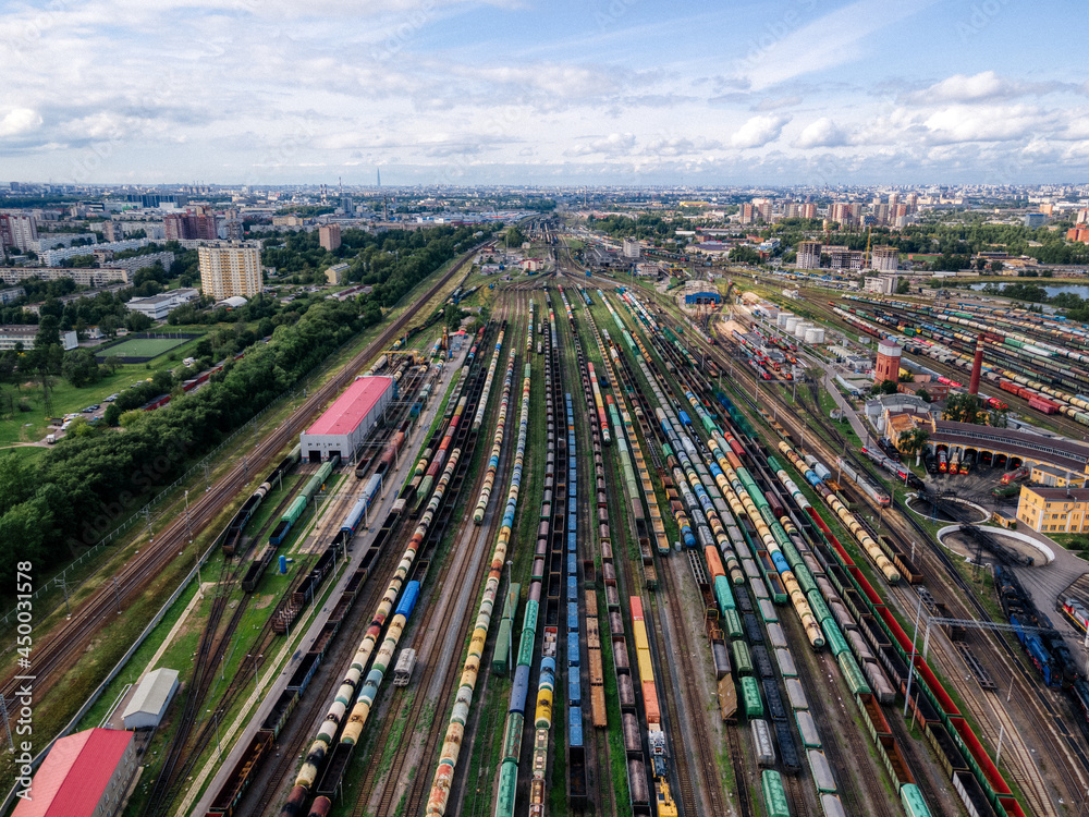 Aerial photo of railway terminal. Freight wagons with goods on railroad ...