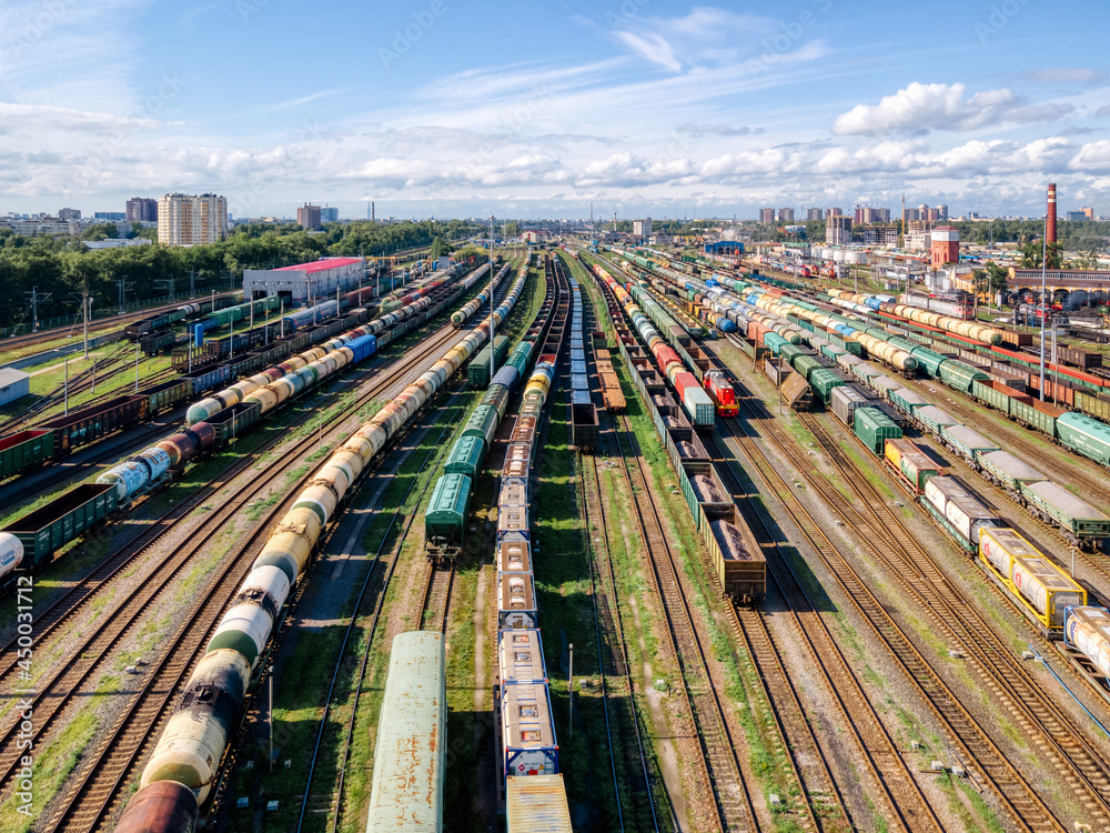 Aerial photo of railway terminal. Freight wagons with goods on railroad ...