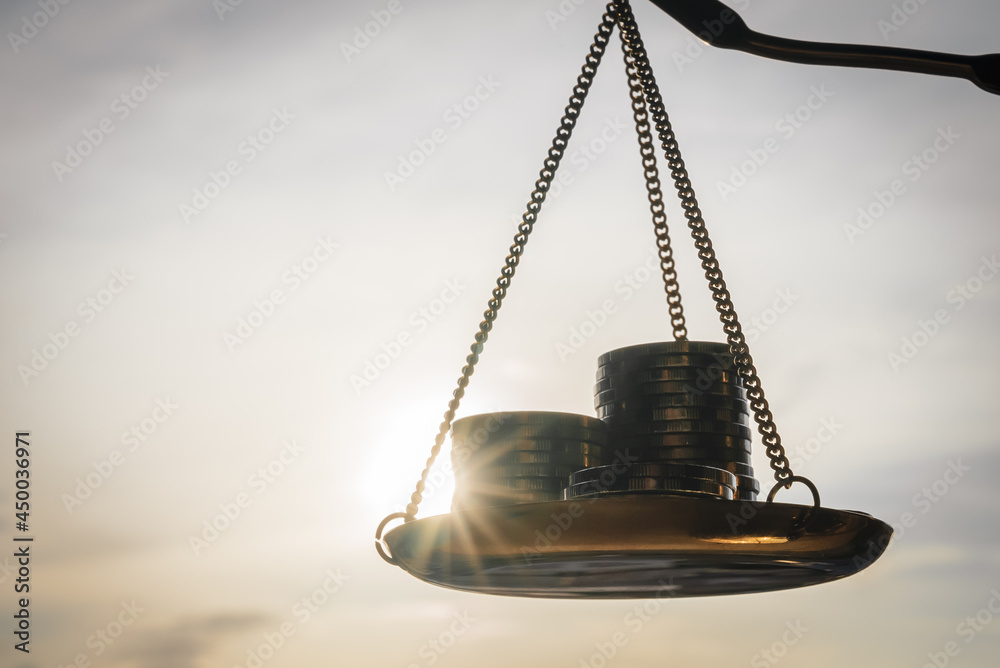 Coins stack with balance scale. Money management, financial plan, time ...