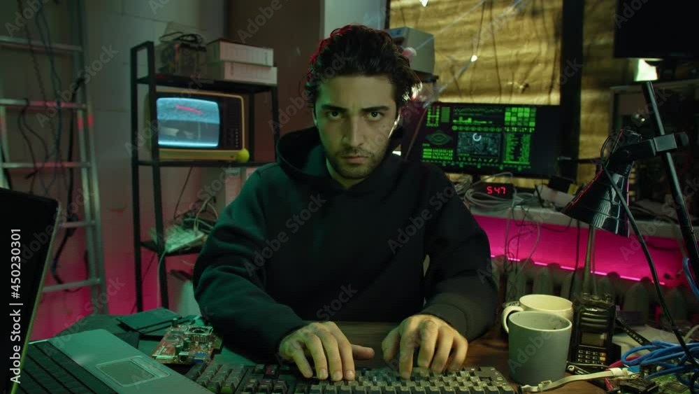 Hacker Typing On Keyboard At Night Breaking Password Using Laptop And Bypassing Cybersecurity