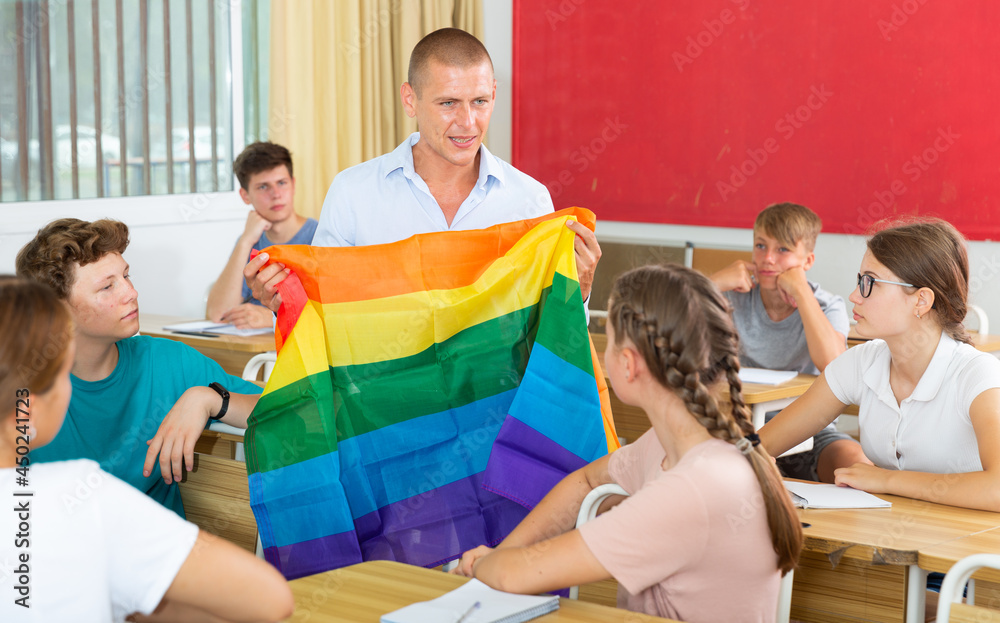 Photo & Art Print Pupils in classroom listen to the teacher who ...