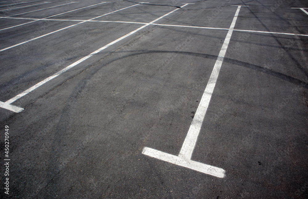 Parking kiosks in the parking lot, marked with white lines. Empty ...
