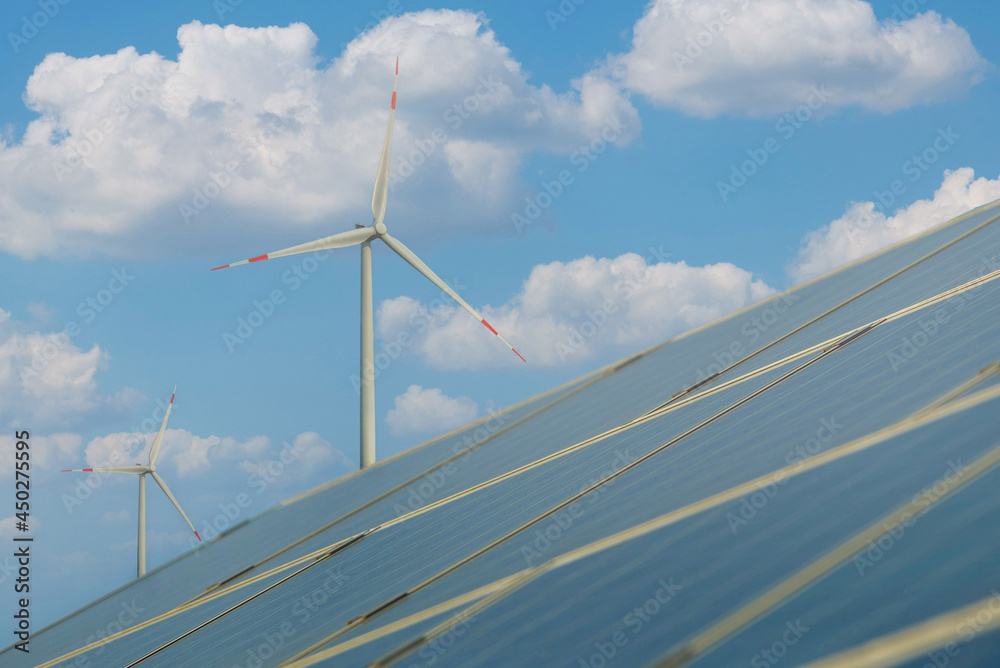 Photovoltaics solar panel and wind turbines generating electricity ...