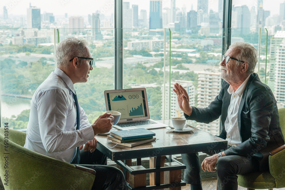 two senior management businessman debating in meeting with data ...