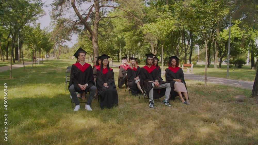 Rear view of african university dean with academic staff standing at ...