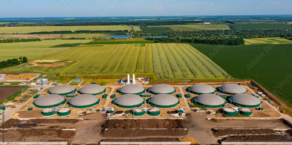 Green biogas plant storage tanks. Aerial view over biogas plant and ...