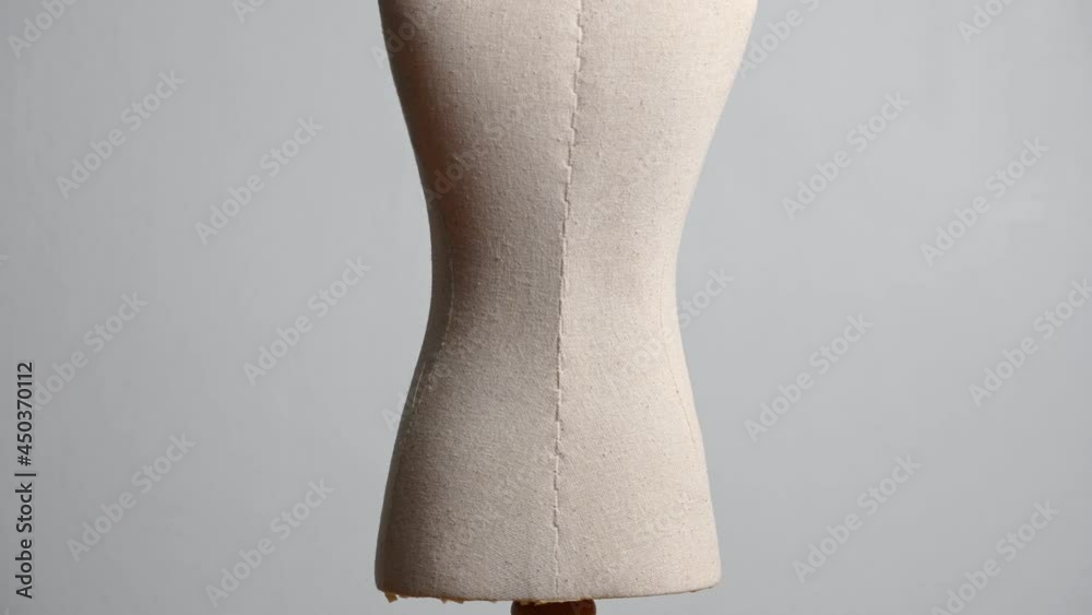 close up of a fabric and wood vintage dummy dress mannequin standing ...