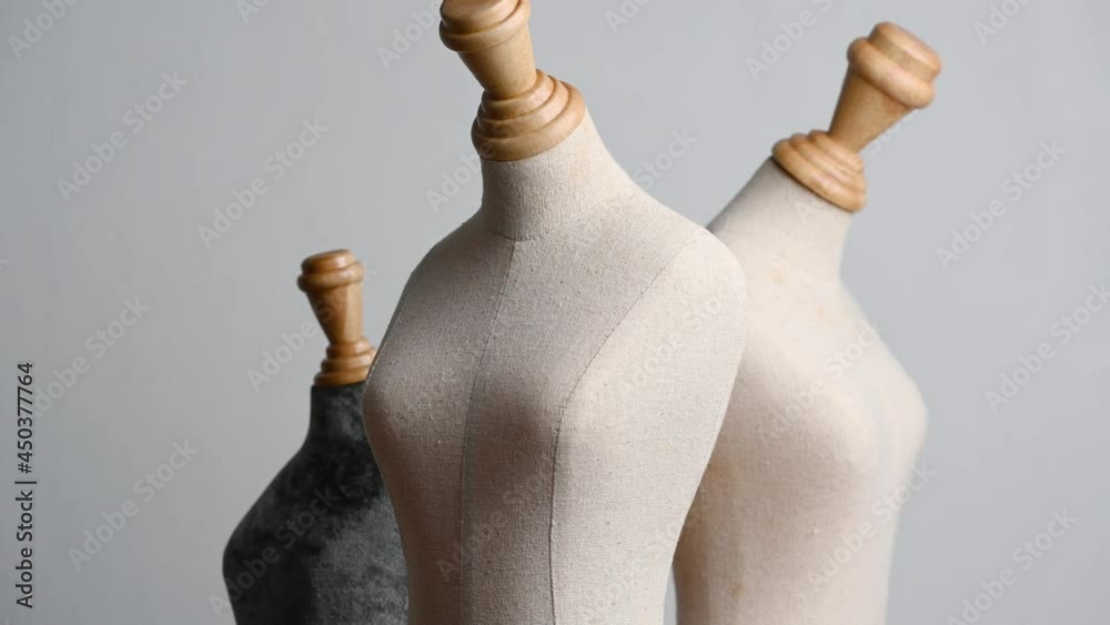 close up of a fabric and wood vintage dummy dress mannequin standing ...