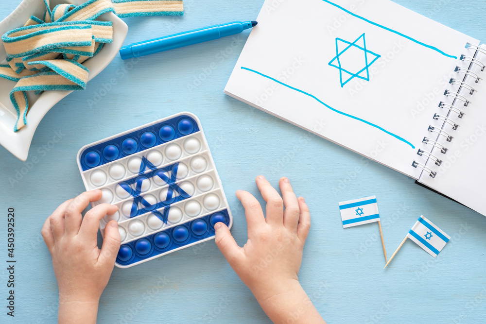 Sensory Fidget Toy in the form of Israeli flag, child hands, items with ...