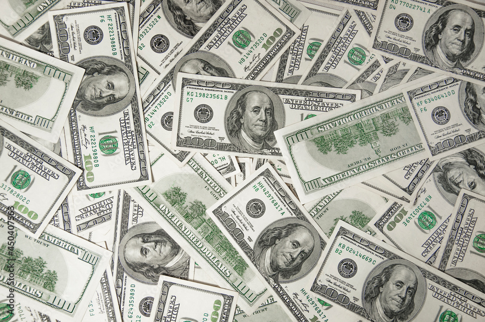 money, American dollars are in bulk on the surface of the table. High ...
