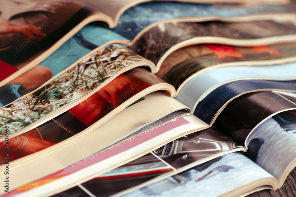 Stack of magazines .Closeup background of a pile of old magazines with ...