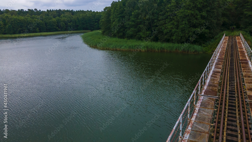 Iron steel frame construction of narrow gauge railway bridge across the ...