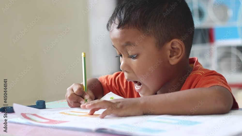 Cute child boy studying and thinking at the home. Cute child boy artist ...