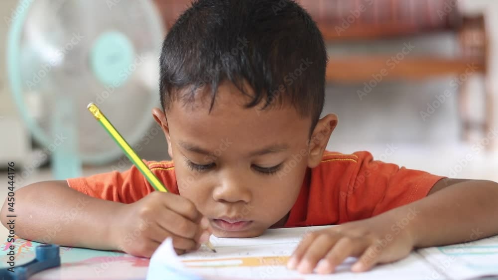 Cute child boy studying and thinking at the home. Cute child boy artist ...