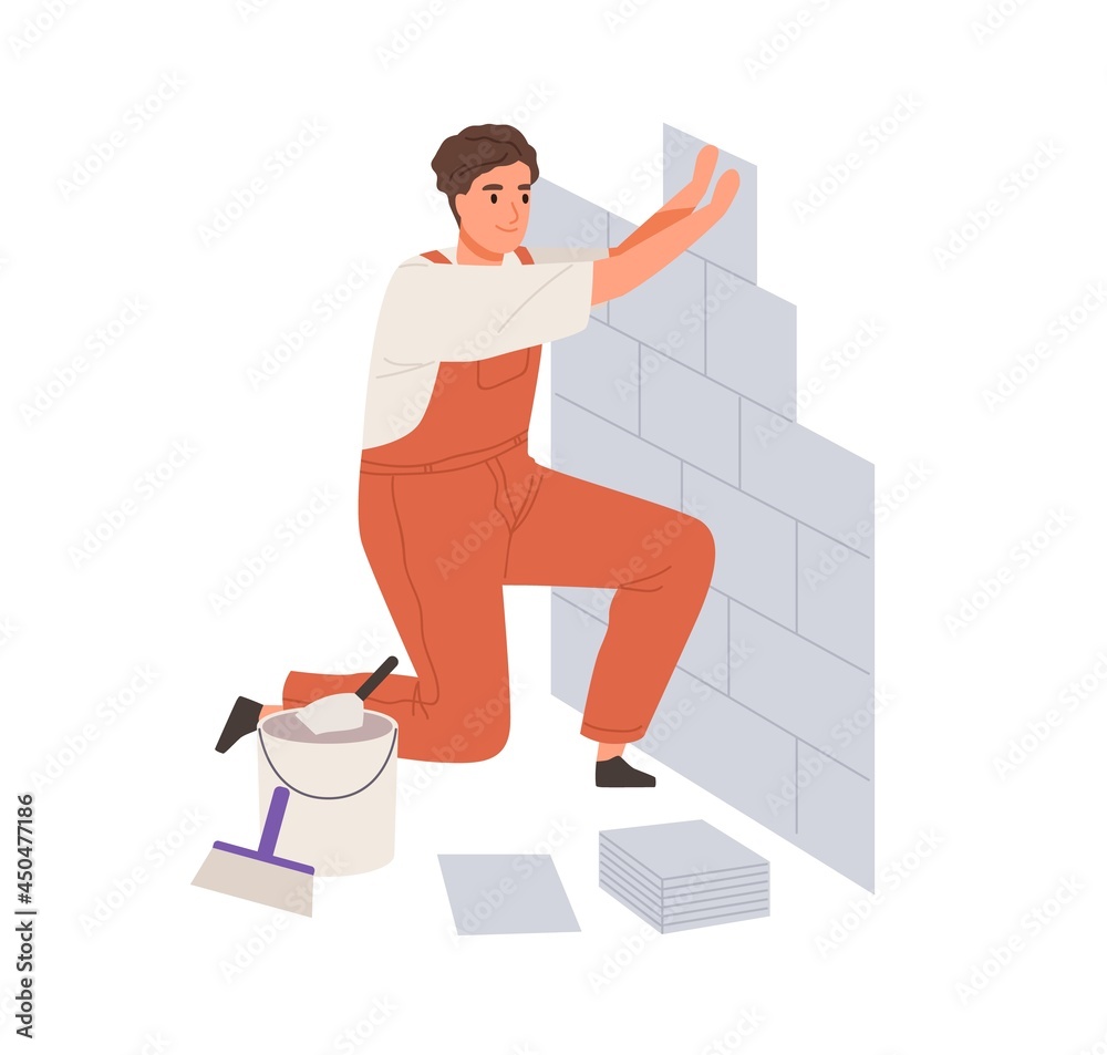 Repair worker laying ceramic wall tile. Professional tiler in uniform ...