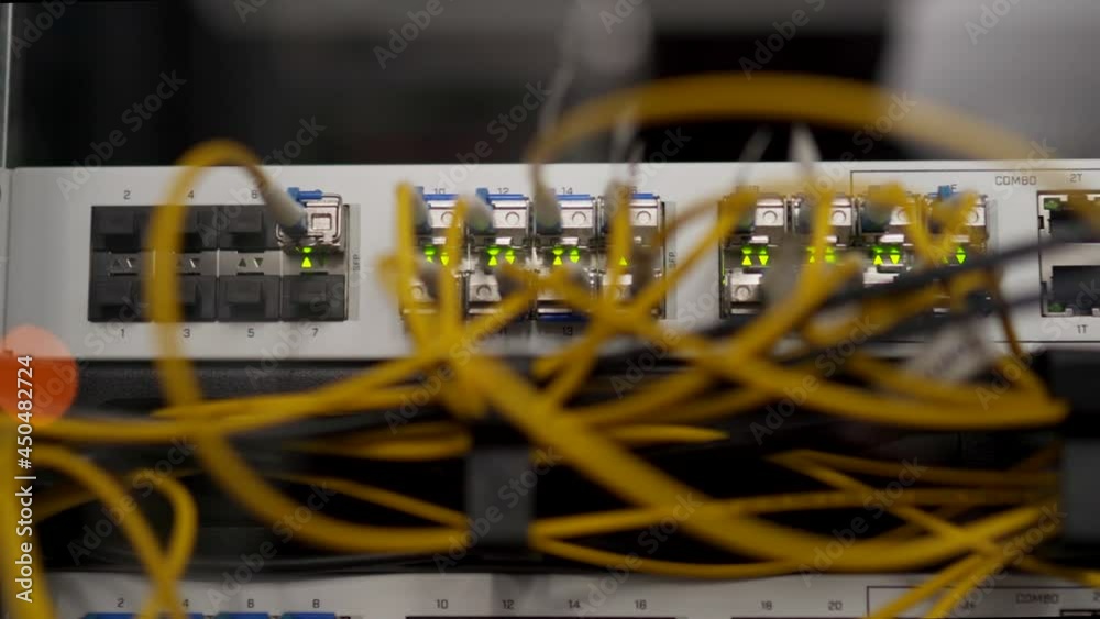 Optical server and router of the data center server room. Network equipment blinking with lights ...