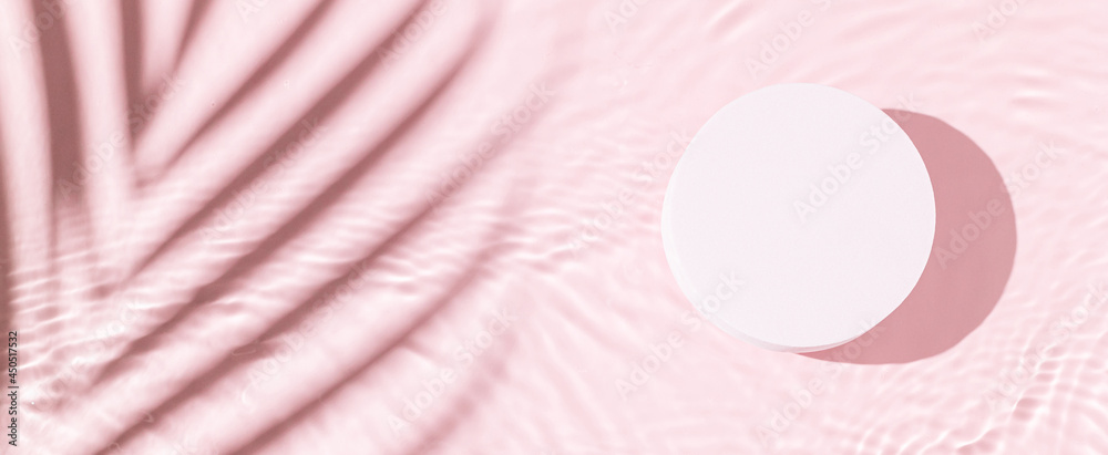 Pink transparent clear calm water surface. Texture with palm tree ...