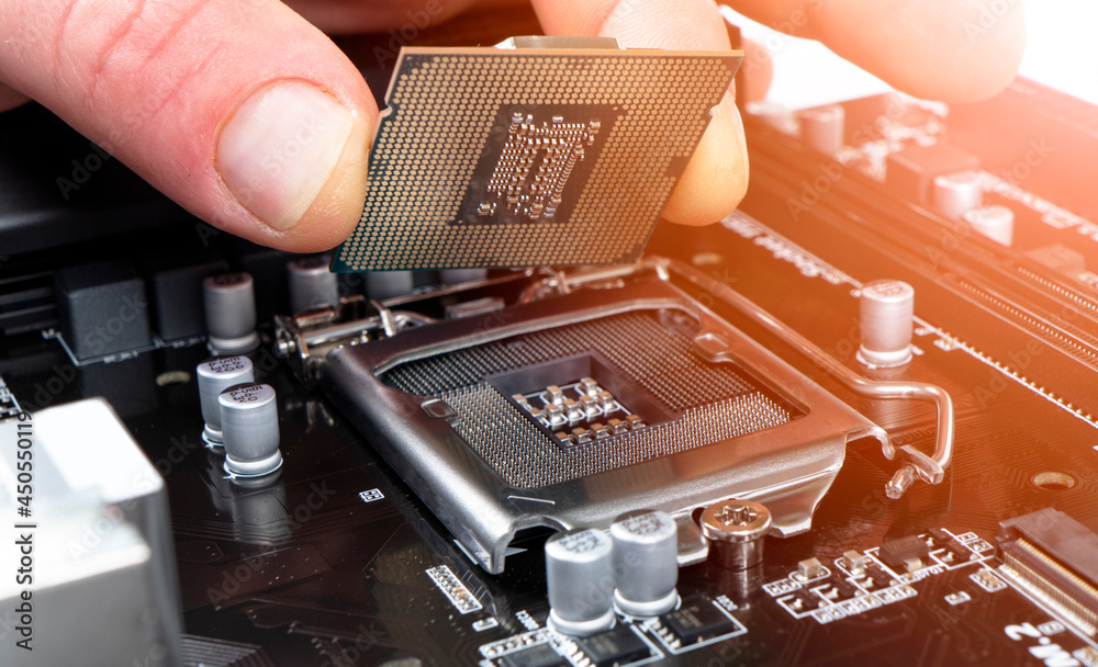 Electronic engineer installing microprocessor. Maintenance computer cpu ...