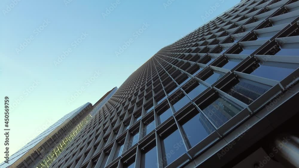 Low generic upward-looking aerial view of city commercial building with ...