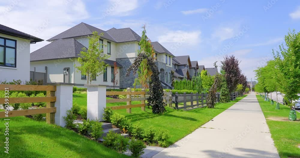Establishing shot. Neighbourhood of luxury houses with street road, big ...