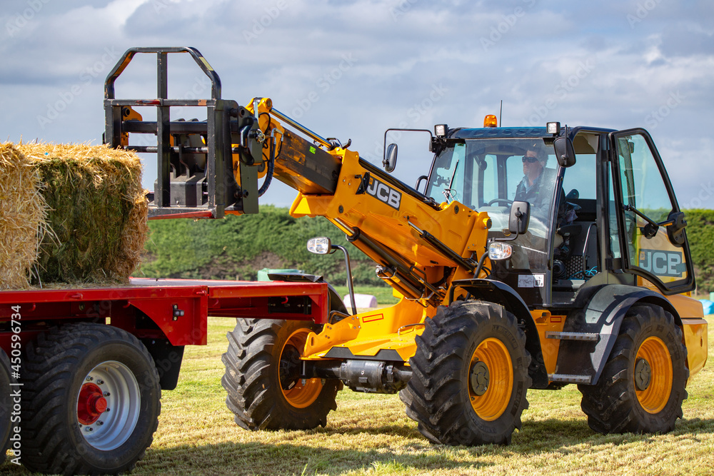 Kirwee, Canterbury, New Zealand, March 27 2019: A farmer demonstrates ...