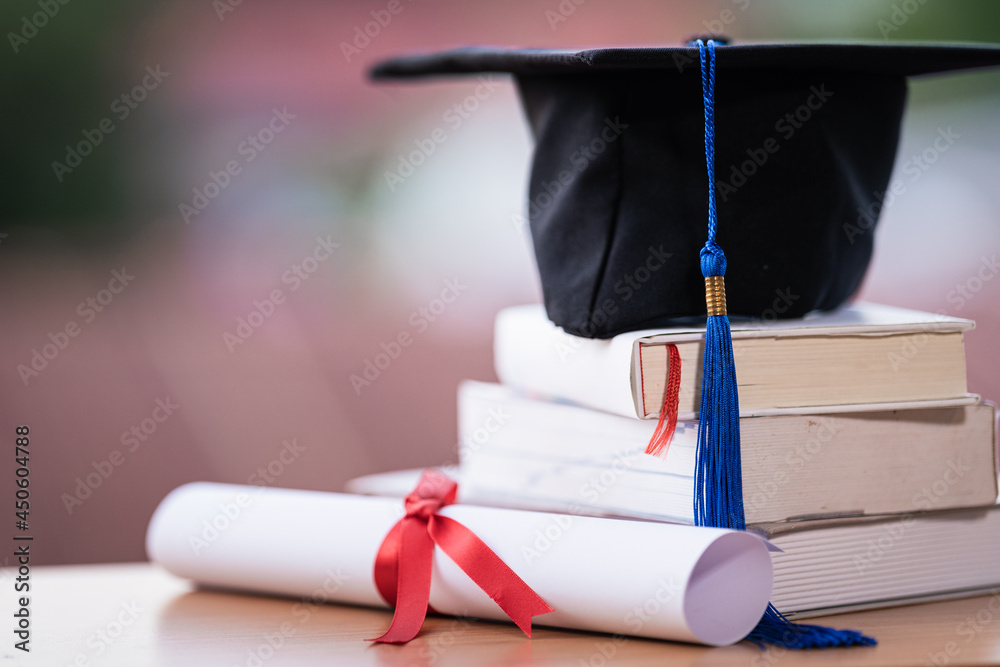 Cropped photo of a university graduation hat mortarboard and diploma ...