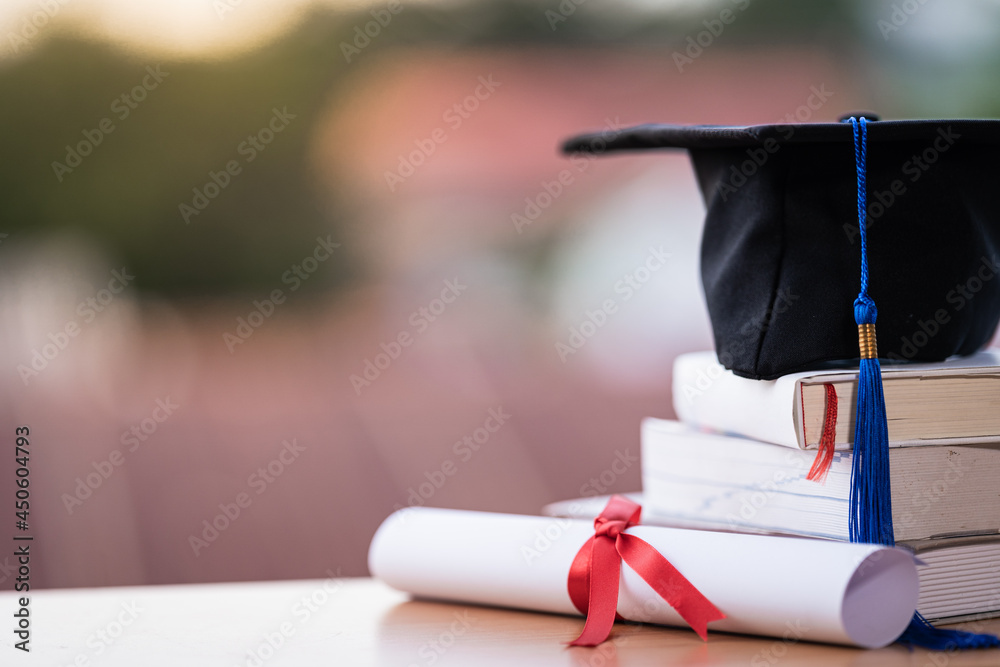 Cropped photo of a university graduation hat mortarboard and diploma ...