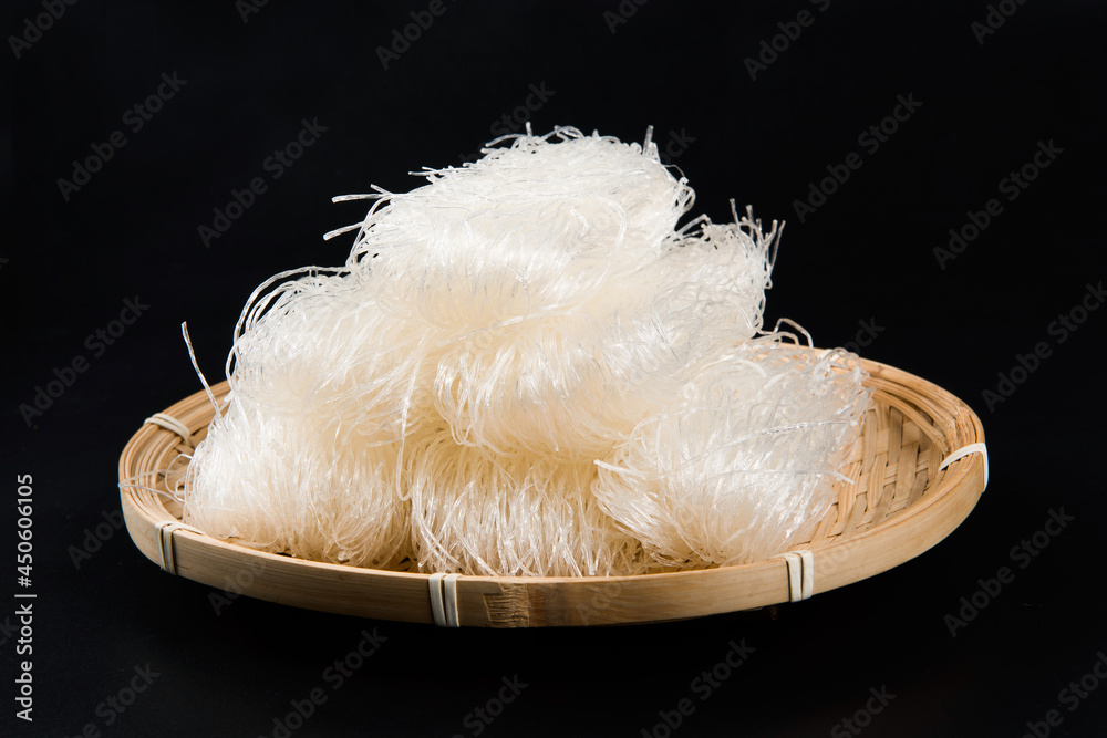 Raw bean vermicelli or dry glass noodles on black background Stock ...