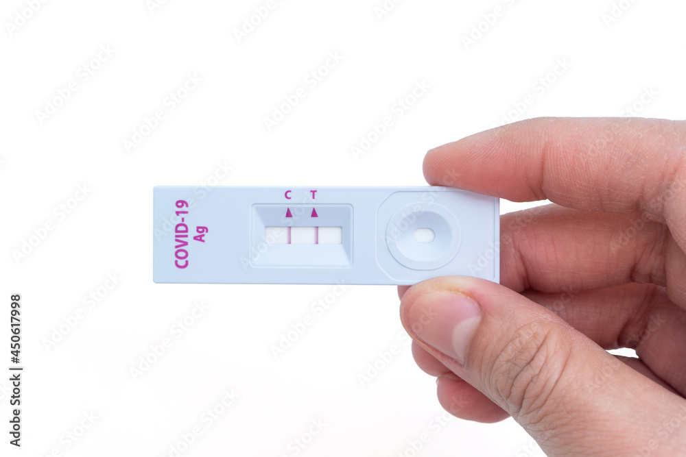 Hand holding a Positive Result for COVID-19 with Rapid Antigen Test ...