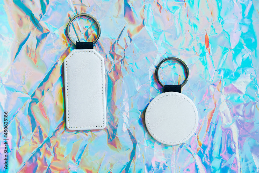 Keychain mockup on holographic background to display design. Blank ...