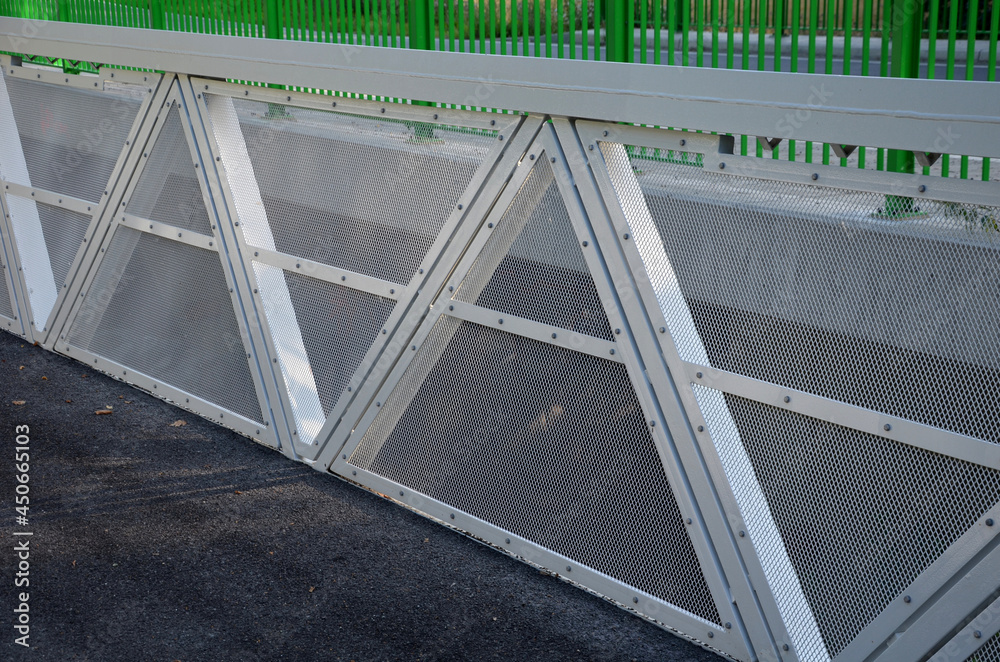 path for cyclists with an asphalt surface. galvanized iron railing over ...