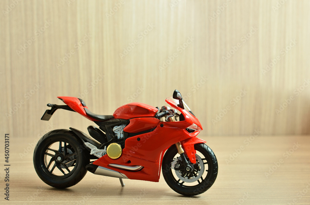 Red motorcycle toy in with background Stock Photo | Adobe Stock