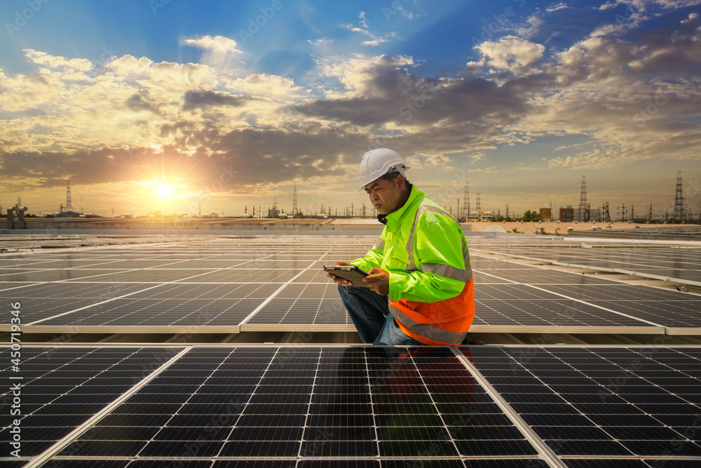 Engineer wearing unifrom and helmet inspect and check solar cell panel ...