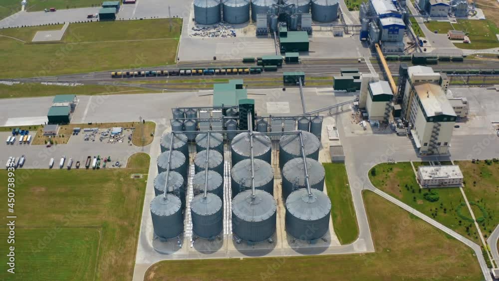 New industrial complex with grain silos. Grain storage tanks in the ...
