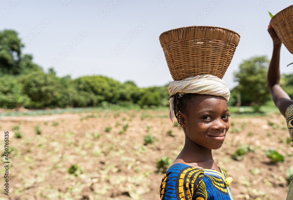 African Woman Carrying Basket On Head