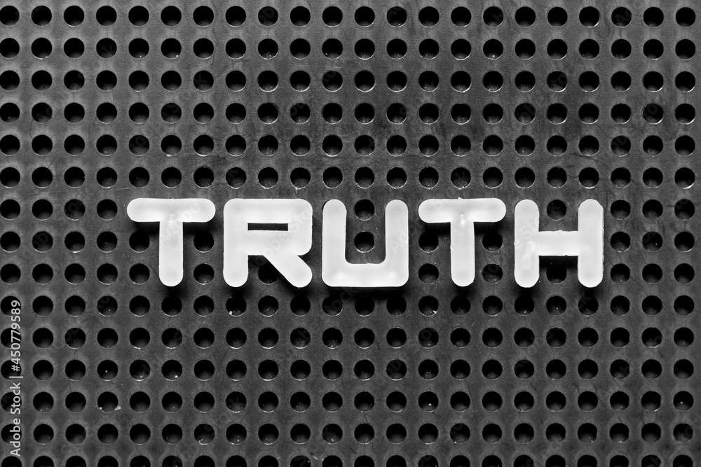 White alphabet letter in word truth on black pegboard background Stock ...