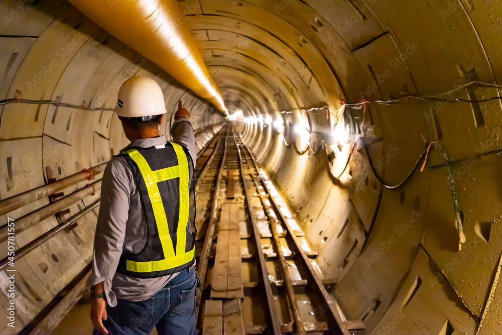 Engineer wear yellow helmets,vests safety are discussing.Technician ...