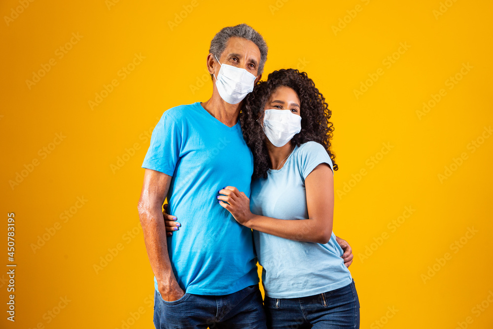 Portrait of African American father with daughter wearing mask. Father ...