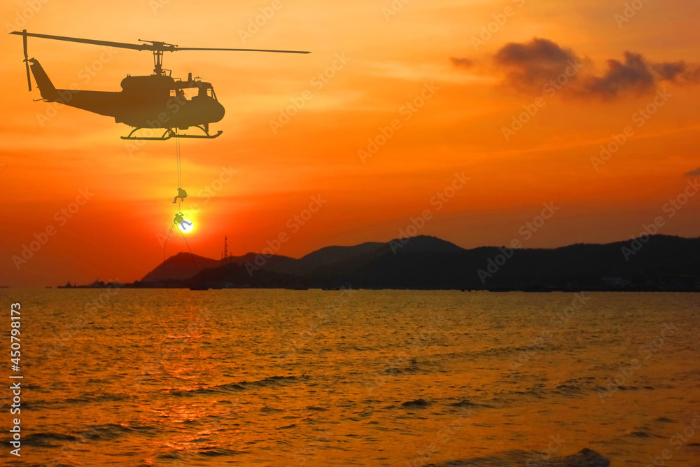 silhouette military helicopter drop soldier on marine duty with sunset ...
