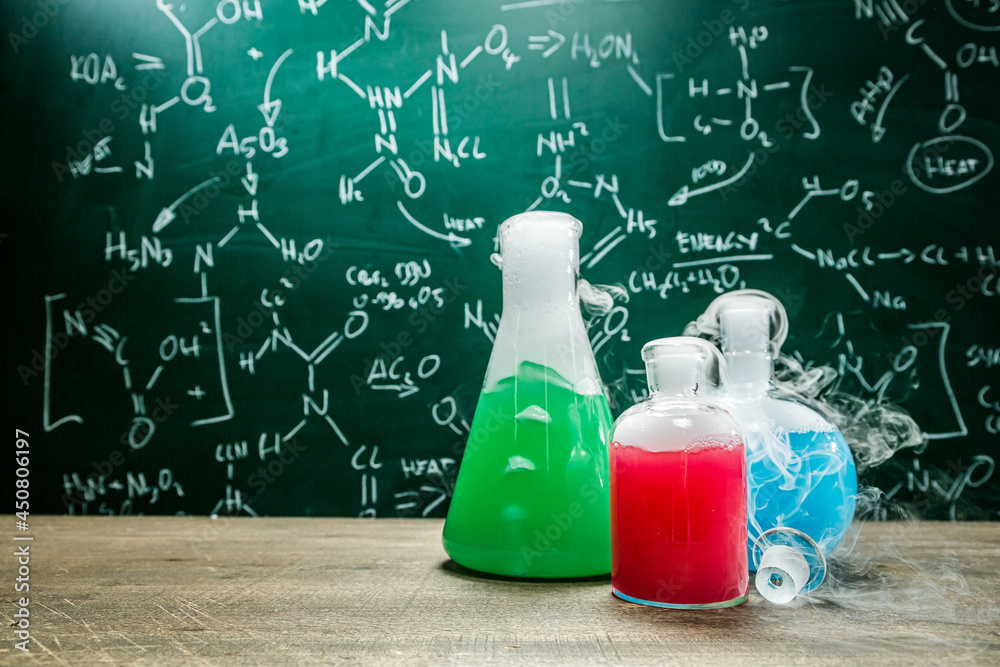 Chemistry class with beakers and books. Practical chemistry classes ...