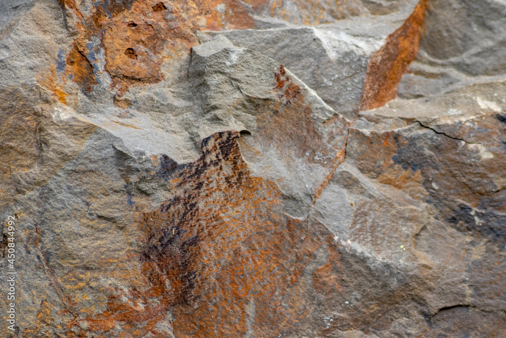 Raw rock in orange with minerals and metals as natural stones ...