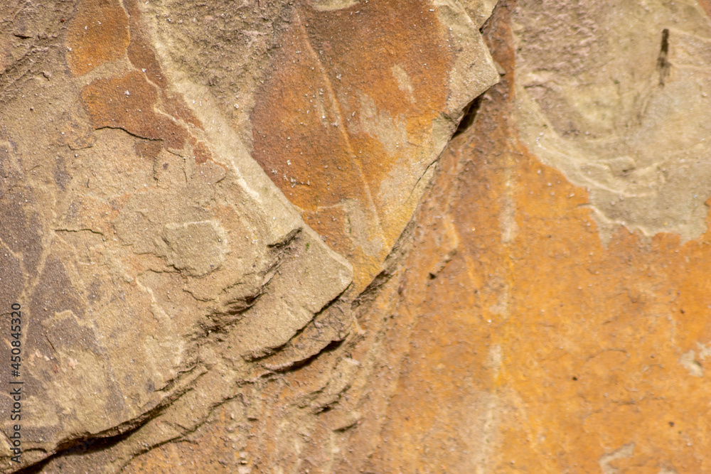 Raw rock in orange with minerals and metals as natural stones ...