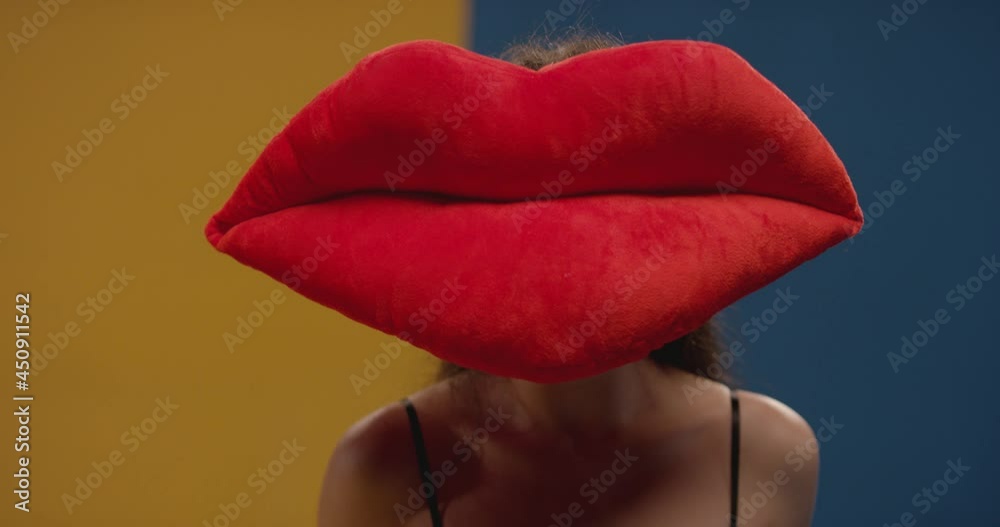 Girl with a lip as a head making the gesture of being shut up. Funny ...