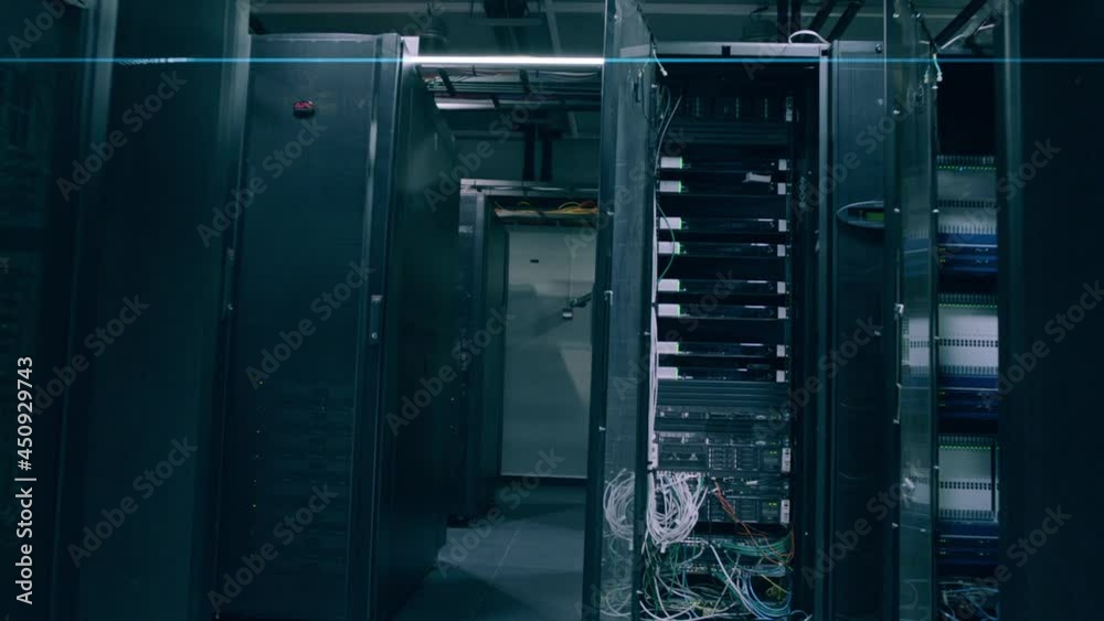 Camera moves through big working data center with server racks . Real ...