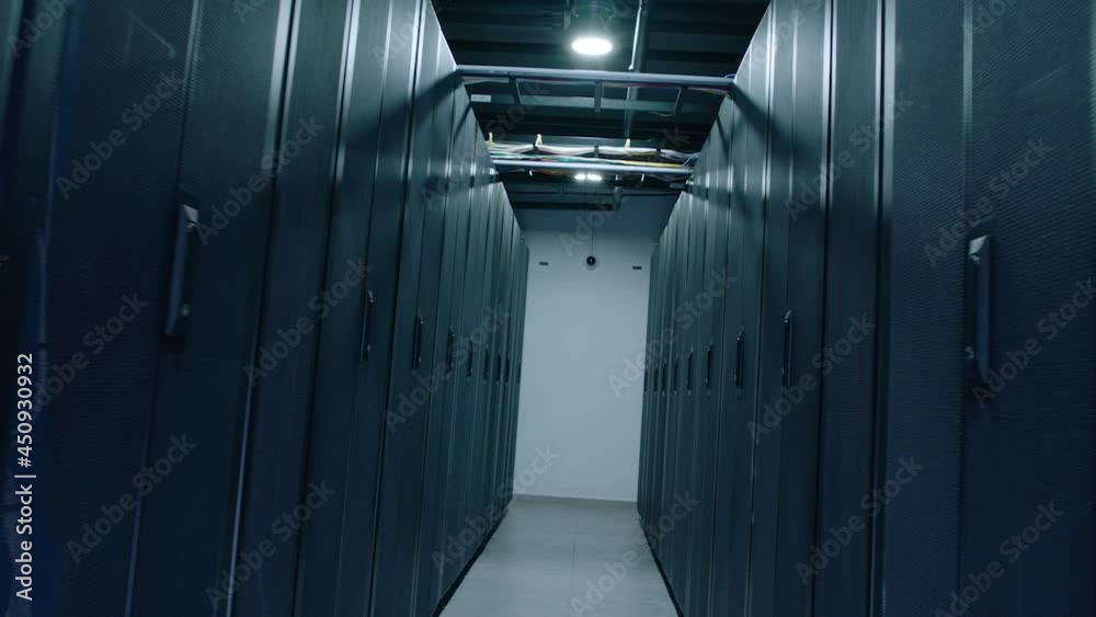 Camera moves through big working data center with server racks . Real ...