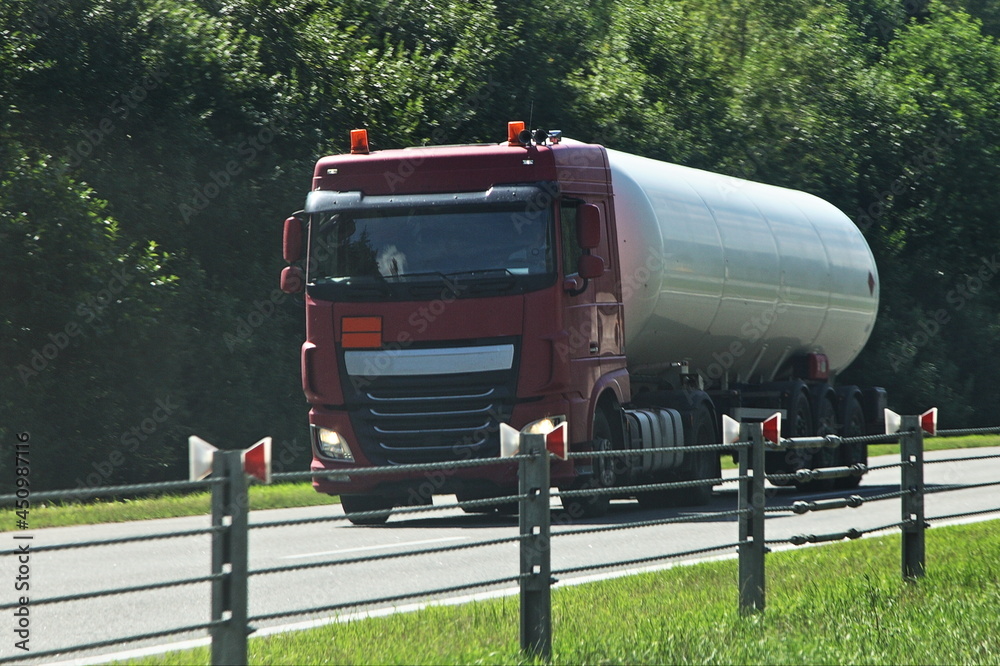 ADR barrel tank truck with empty ADR sign front side view on suburban ...